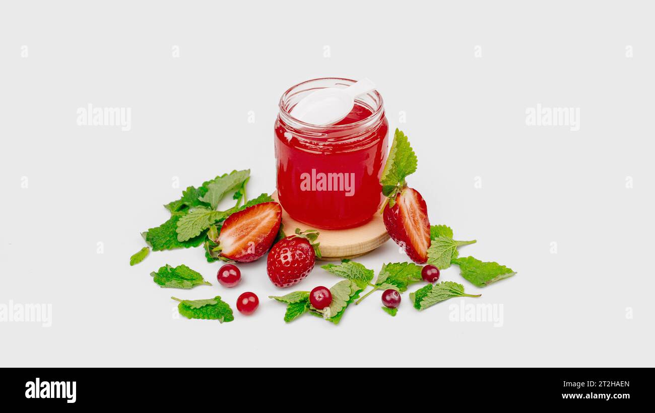 Fruit jelly in a jar with fresh strawberry and mint. Mockup dessert ...