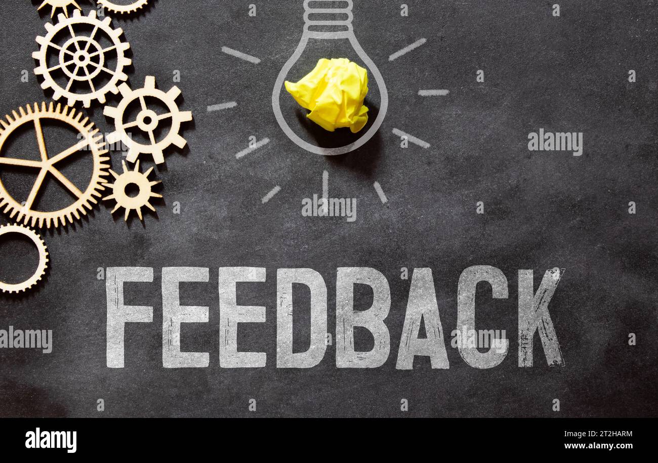 Feedback text on wooden block with happy, sad and neutral emotion faces ...