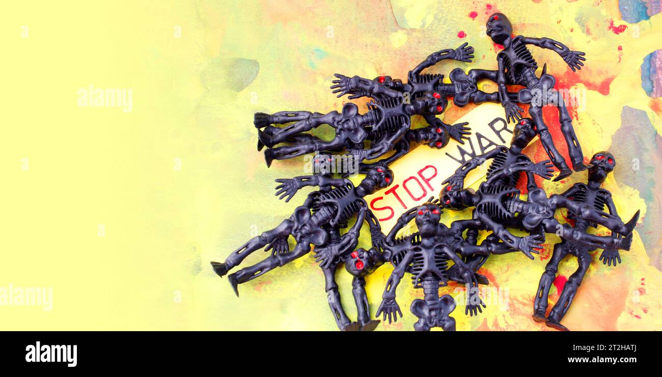 Group of fallen skeletons surrounding end to war sign Stock Photo - Alamy