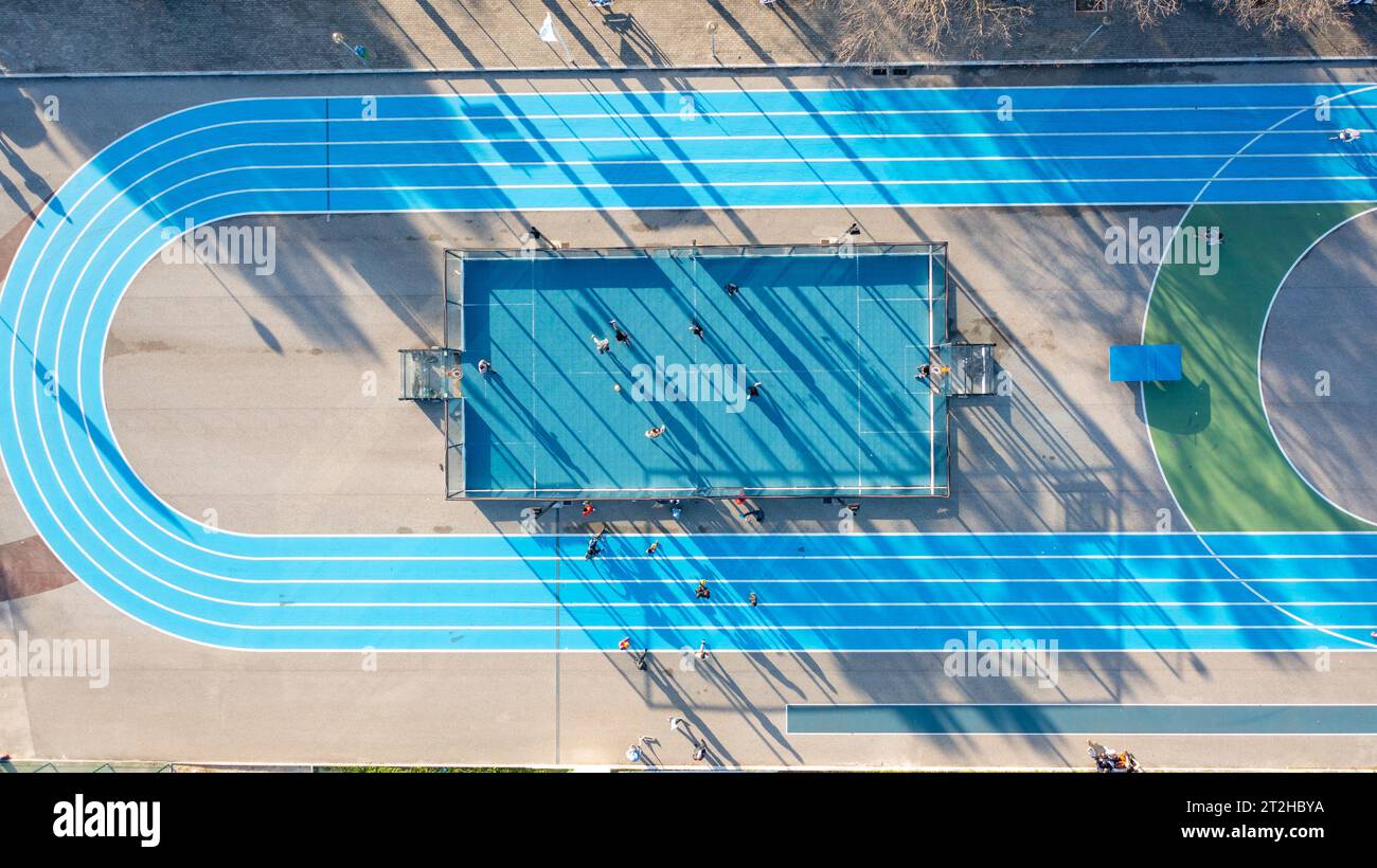 Aerial drone top view of running track mini football soccer field with ...