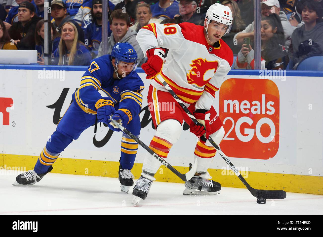 Calgary Flames defenseman Dennis Gilbert (48) and Buffalo Sabres center ...