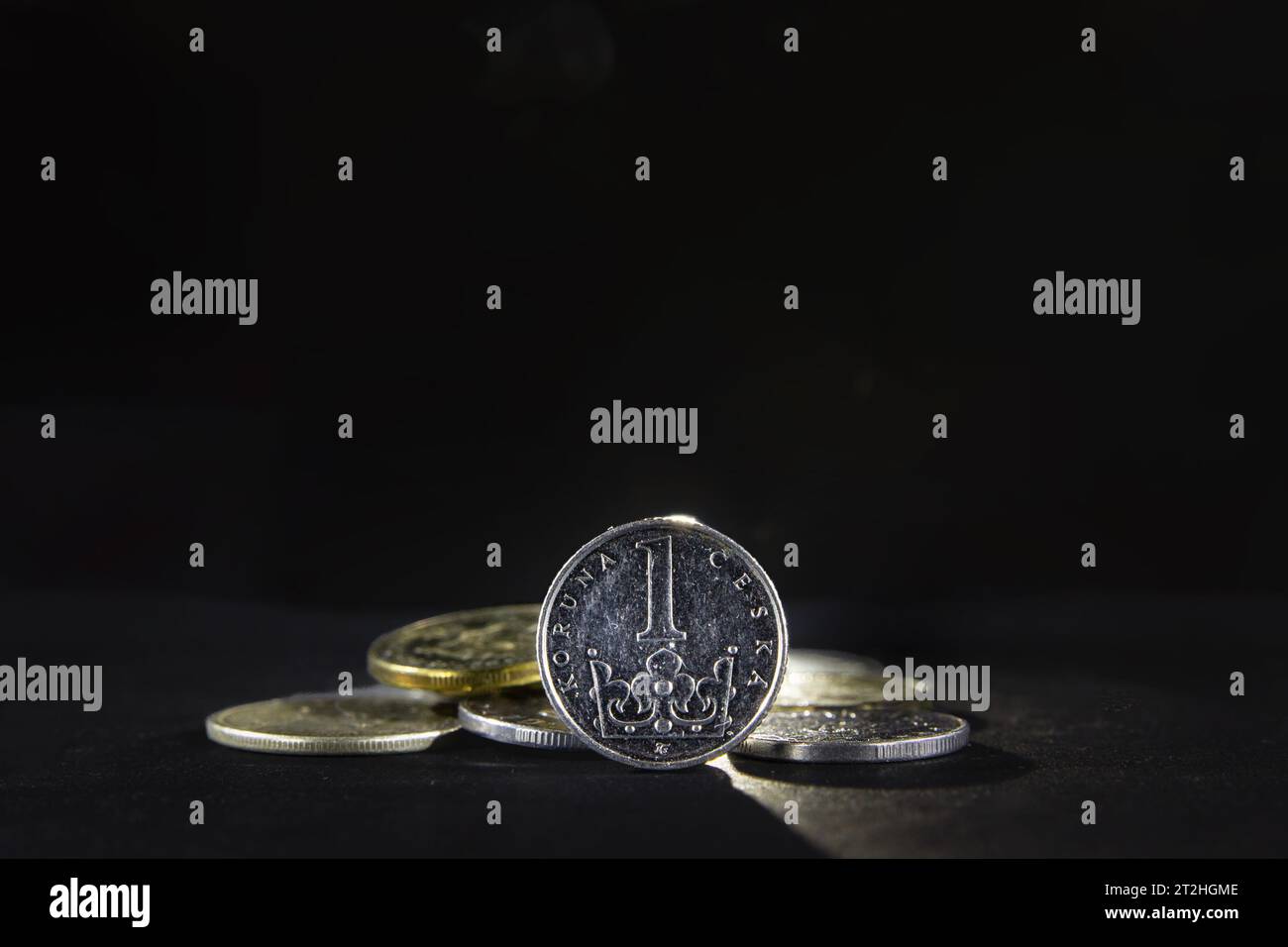 Picture of a coin of one czech crown on a black background. The koruna ...