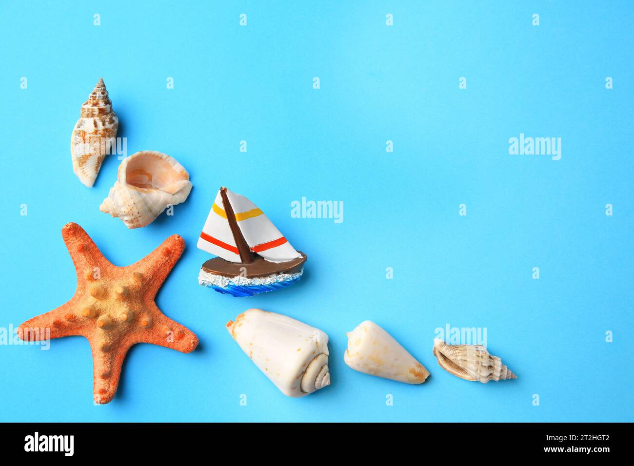 Beautiful starfish, decorative ship and shells on blue background, flat ...