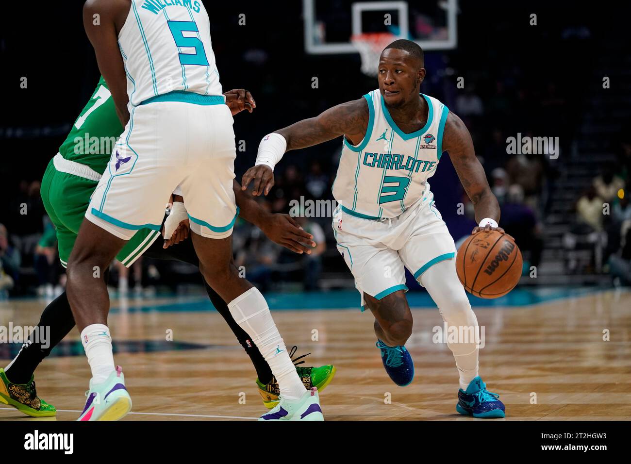 Charlotte Hornets guard Terry Rozier, right, dribbles past Boston Celtics guard Jaylen Brown in ...