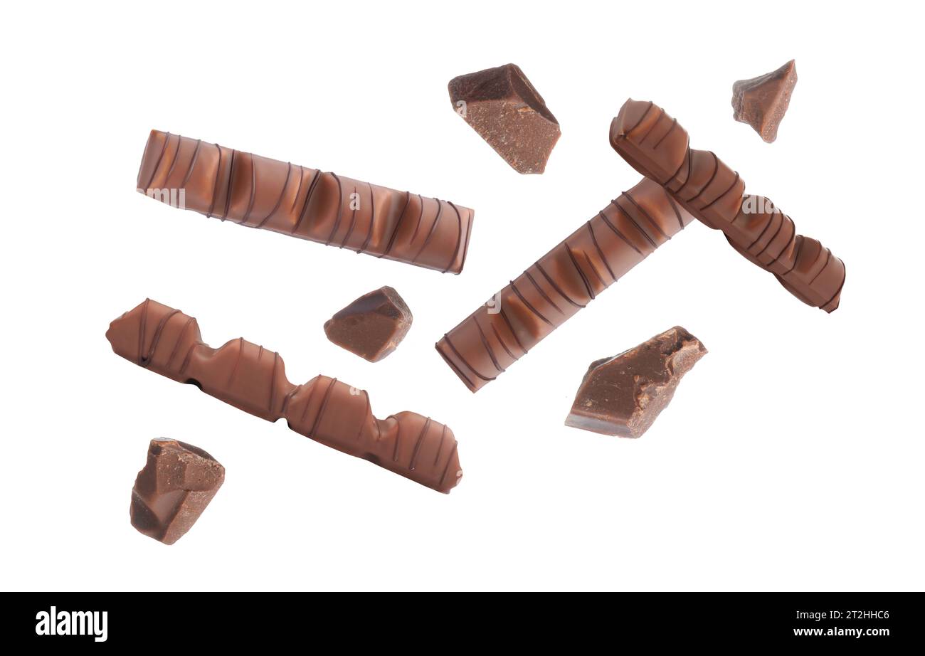 Tasty chocolate bars falling on white background Stock Photo - Alamy