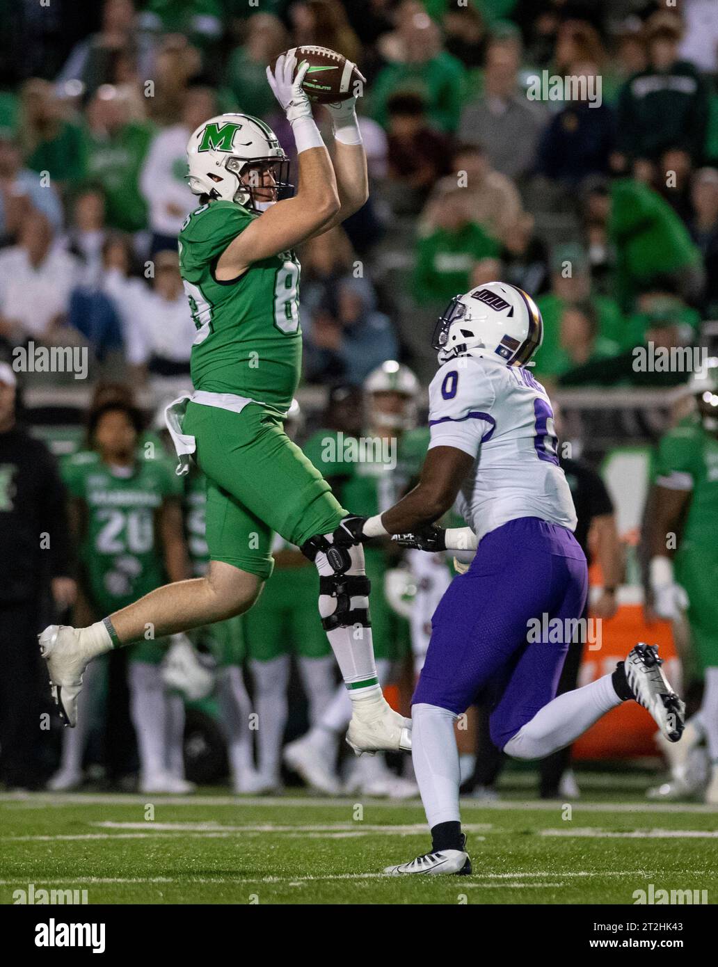 Marshall tight end Cade Conley (83) makes a catch over James Madison ...