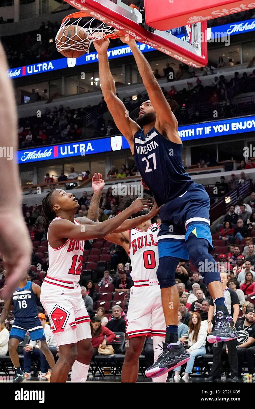 Minnesota Timberwolves center Rudy Gobert, right, dunks as Chicago ...
