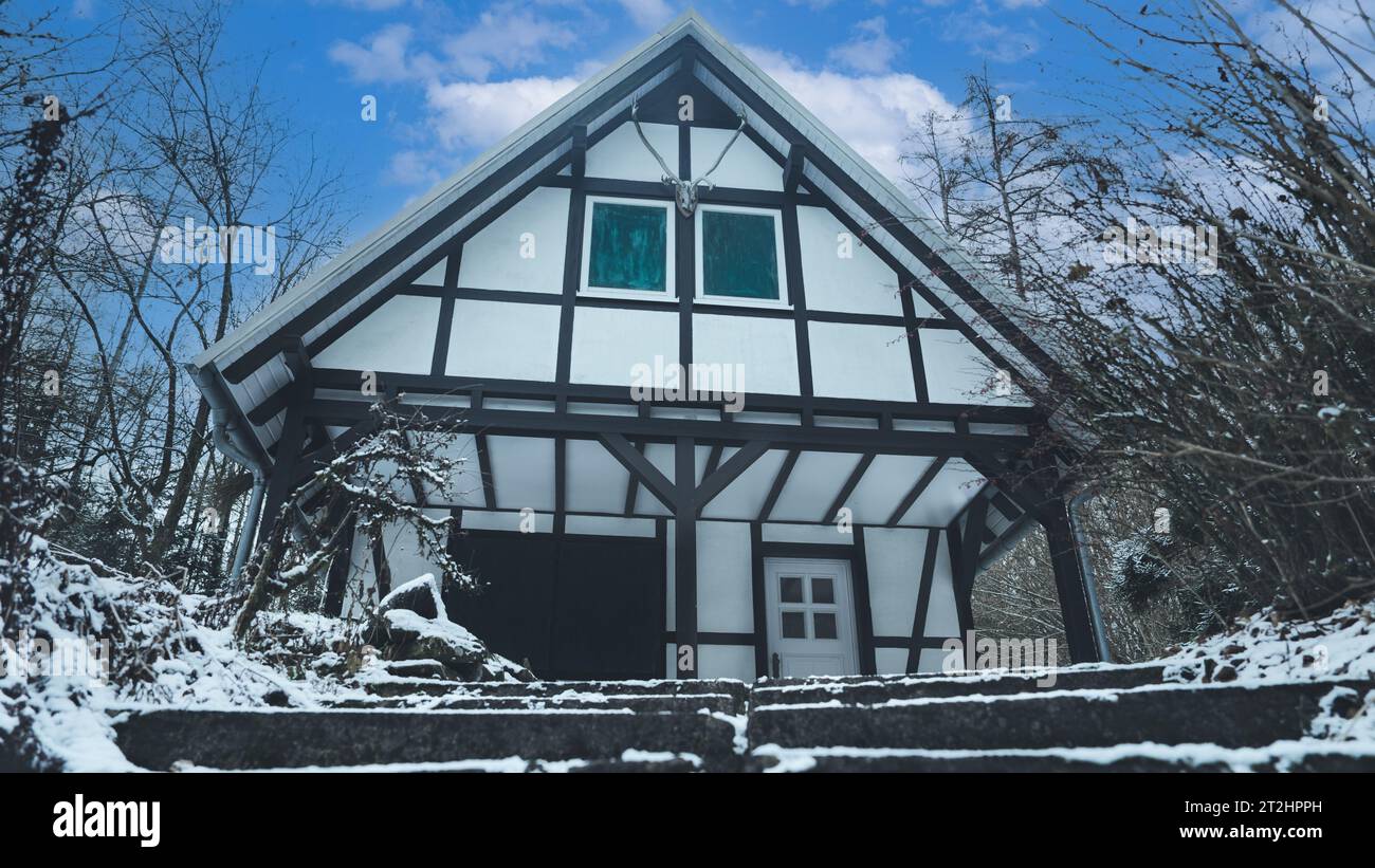 Old timbered house in a snowy forest Stock Photo - Alamy
