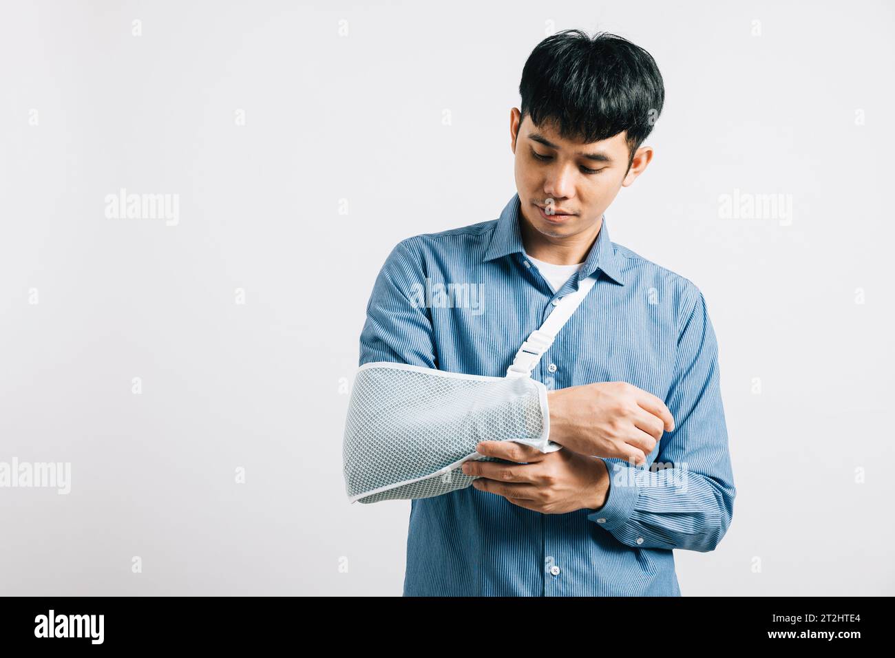 happy Asian man wears arm support in studio shot isolated Stock Photo ...