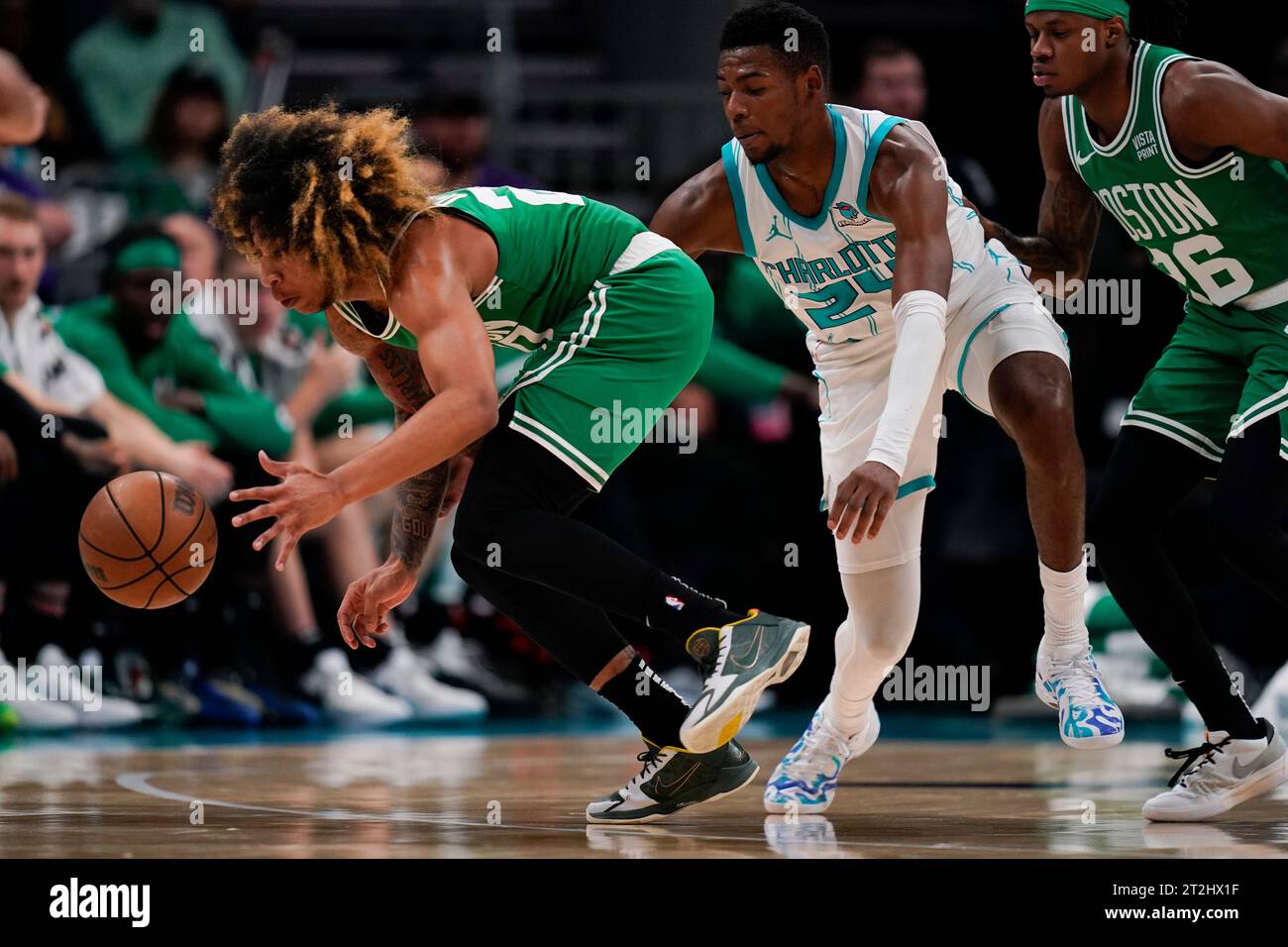 Boston Celtics guard JD Davison, left, and Charlotte Hornets forward ...
