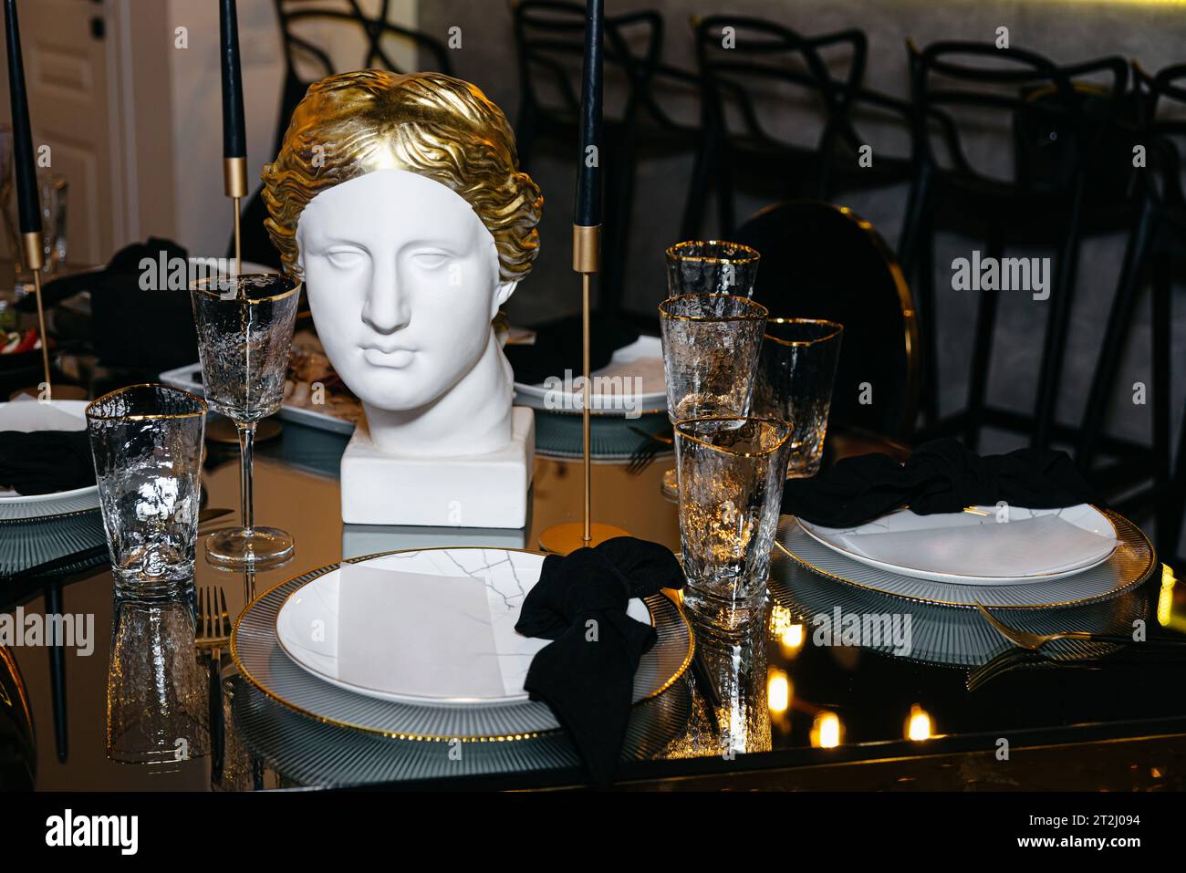 Elegant table setting in luxury restaurant. White marble bust of woman ...