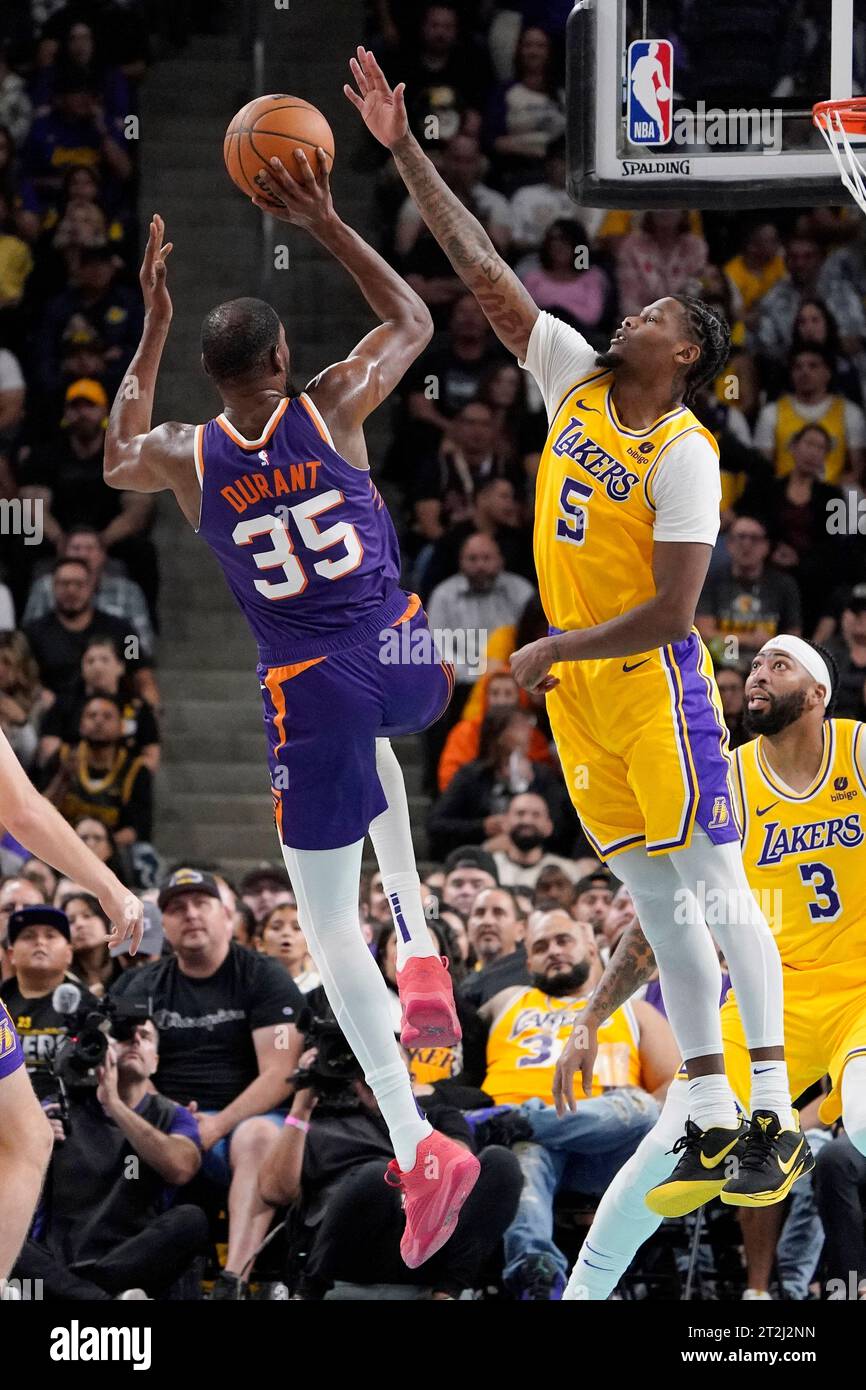 Phoenix Suns forward Kevin Durant, left, shoots as Los Angeles Lakers ...