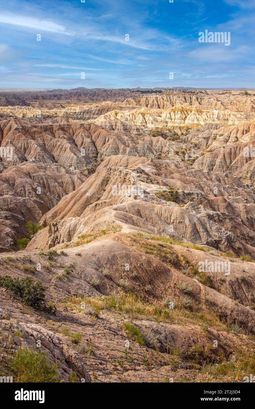 From this scenic overlook in Badlands National Park, a barren landscape ...