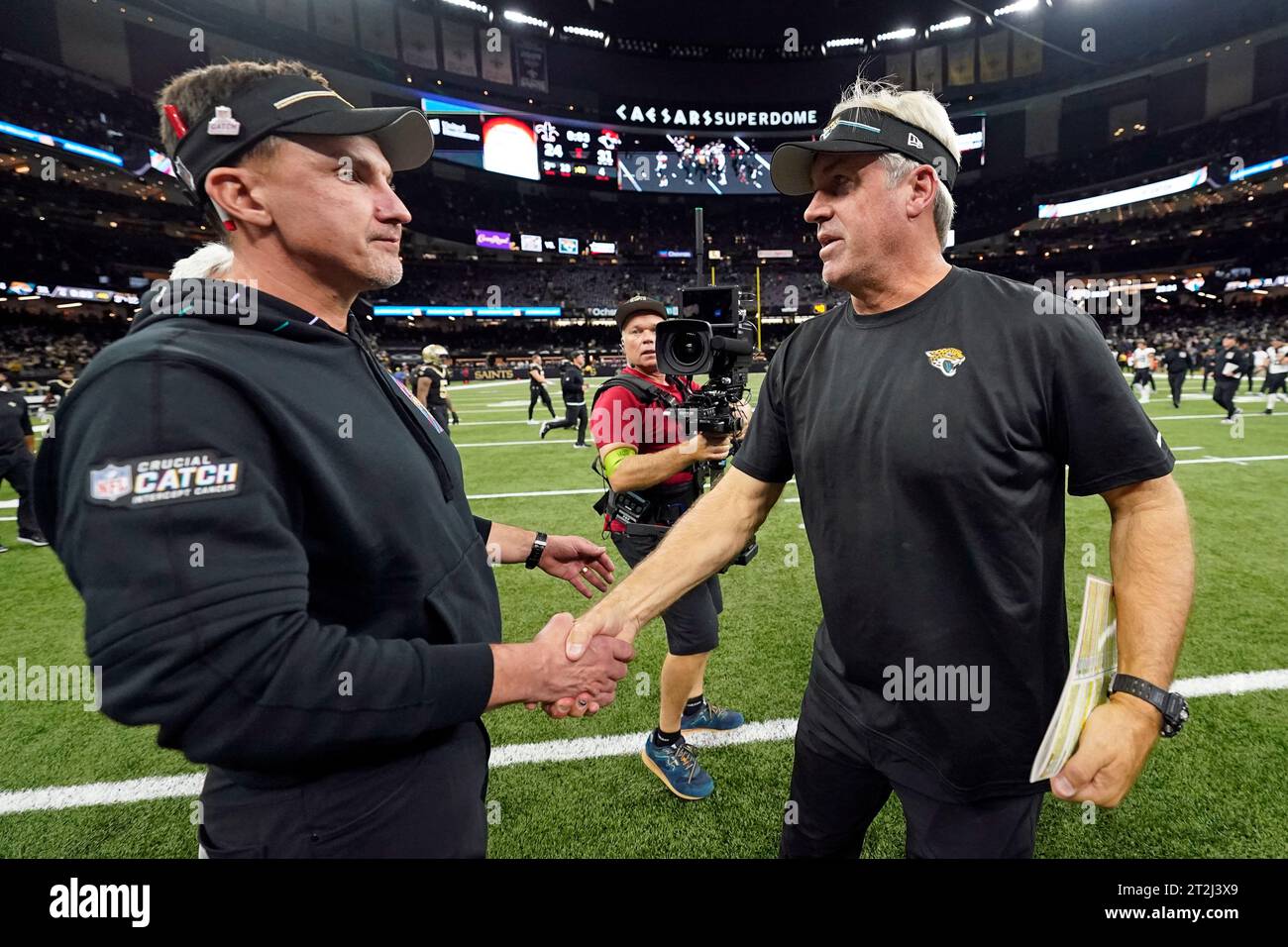 New Orleans Saints head coach Dennis Allen, left, and Jacksonville ...