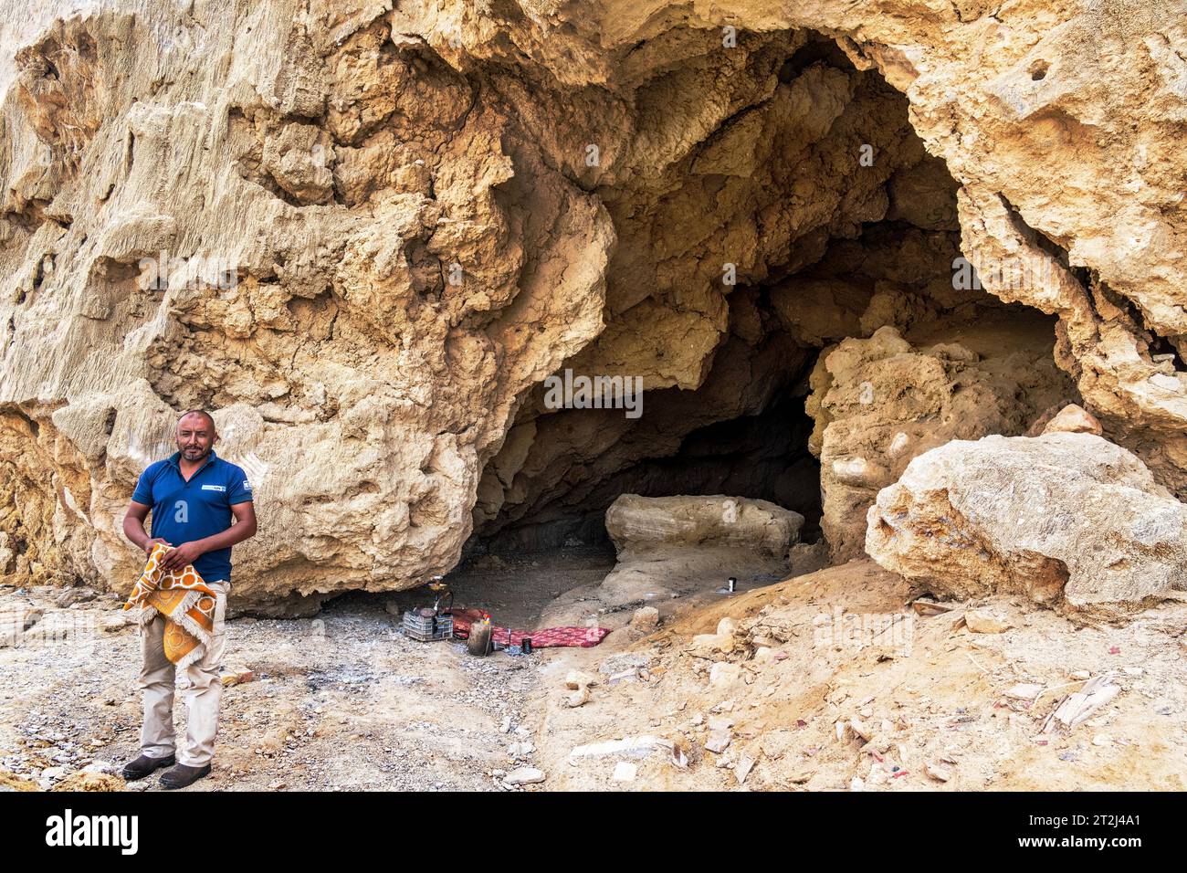 Dead Sea, Israel - August 12, 2023: A Kurdish man guards Fluor Cave ...