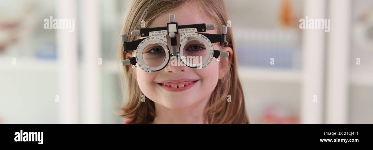 Little girl in ophthalmology goggles for eyesight correction Stock ...