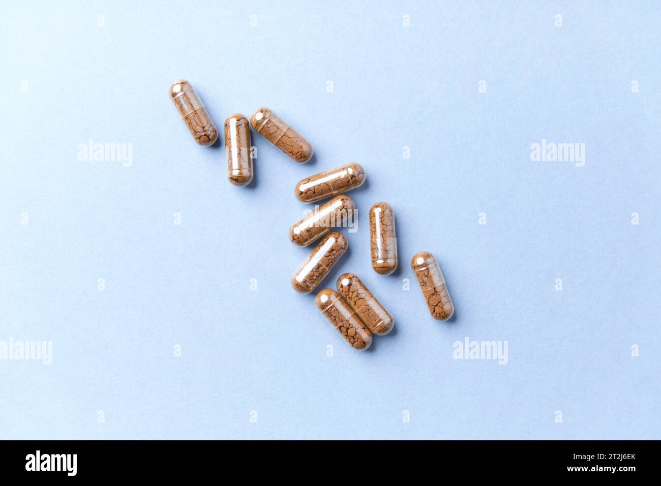 Ashwagandha (Withania somnifera) capsules. Paper background. Soft focus ...