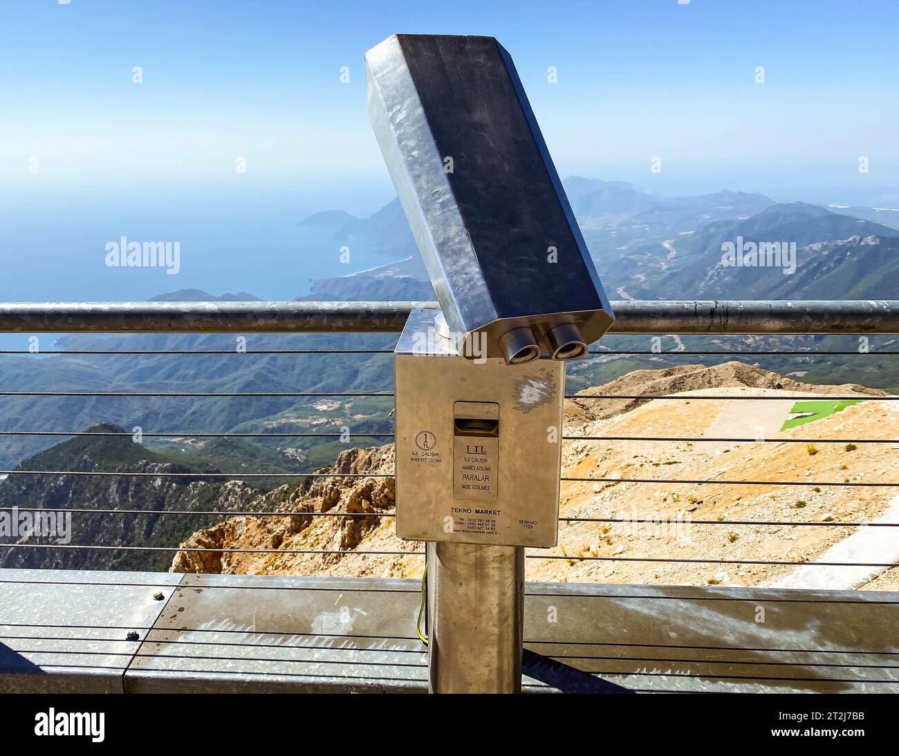 binoculars on a viewing platform made of gray and dense metal ...