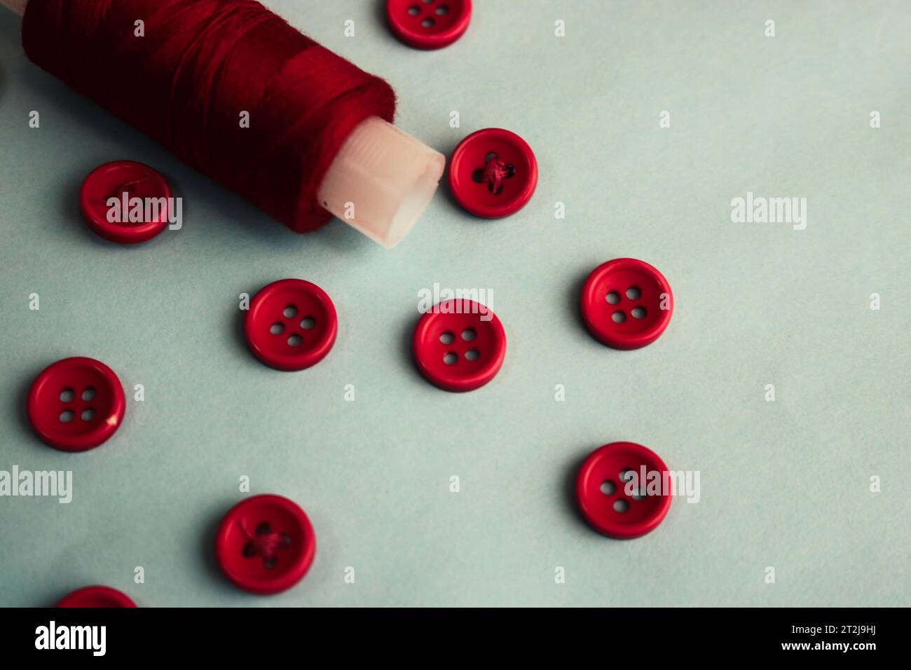 Beautiful texture with lots of round red buttons for sewing, needlework ...