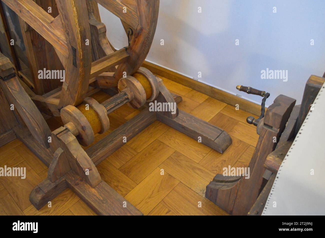 Old ancient medieval wooden mechanism, machine with gears and handles ...