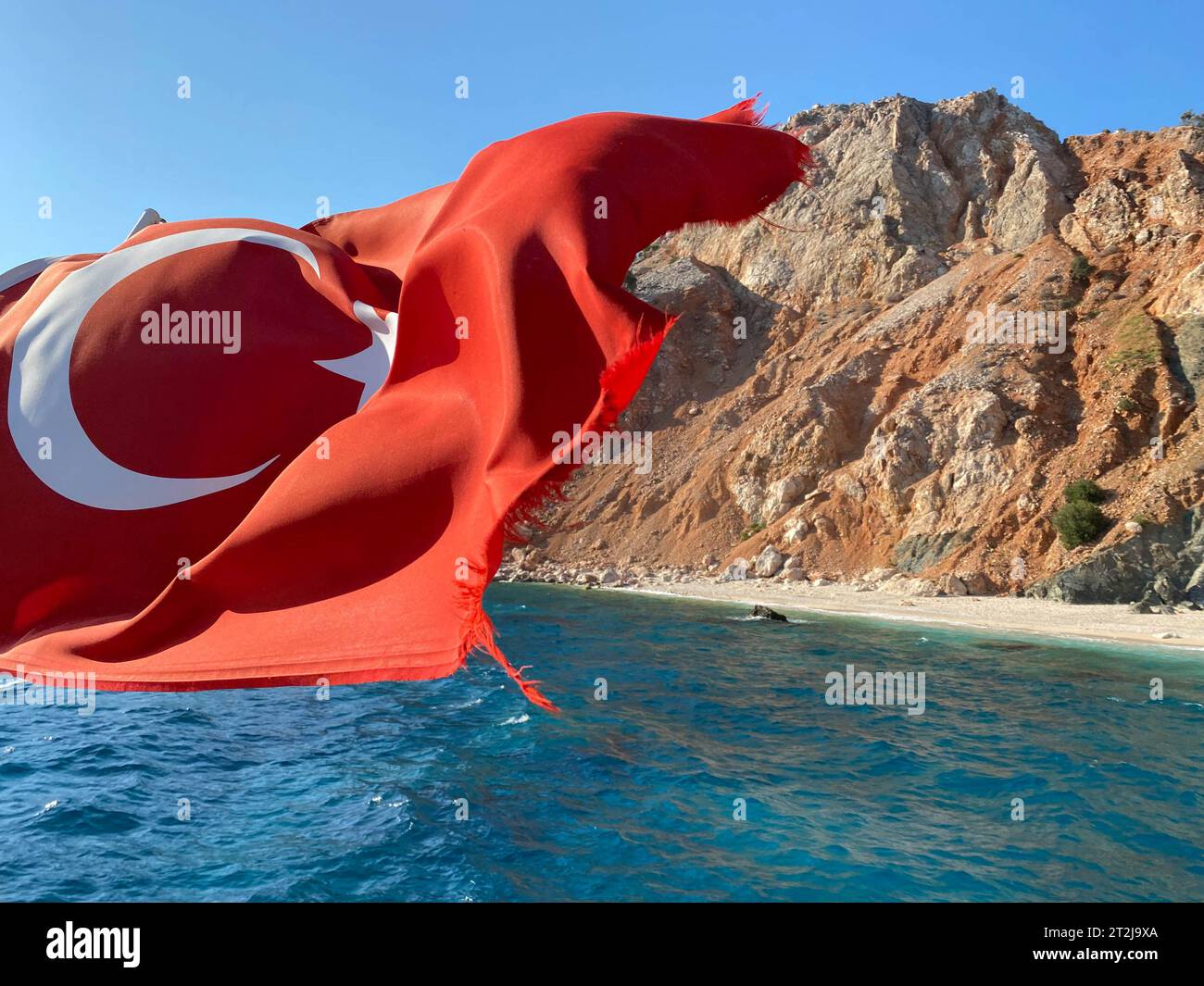 Turkish flag on the background of the mountains in Kemer, in the ...
