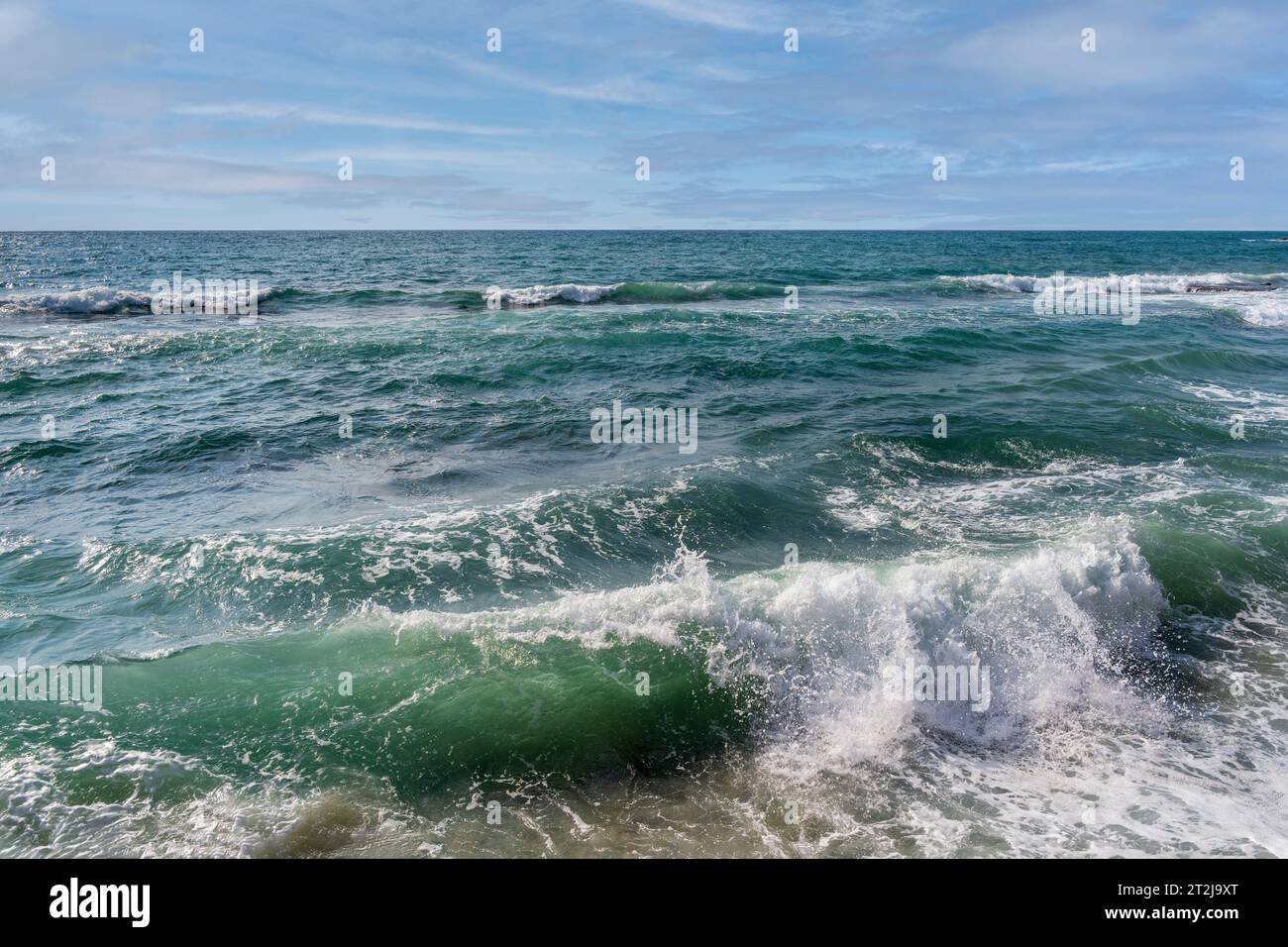 Shoreline waves and sky at the beach at the Mediterranean Sea in ...