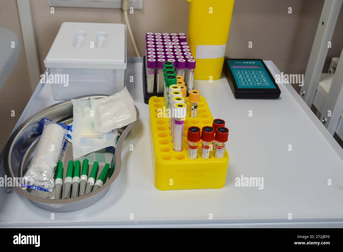 laboratory diagnostics. test tubes with multi-colored caps are in the ...