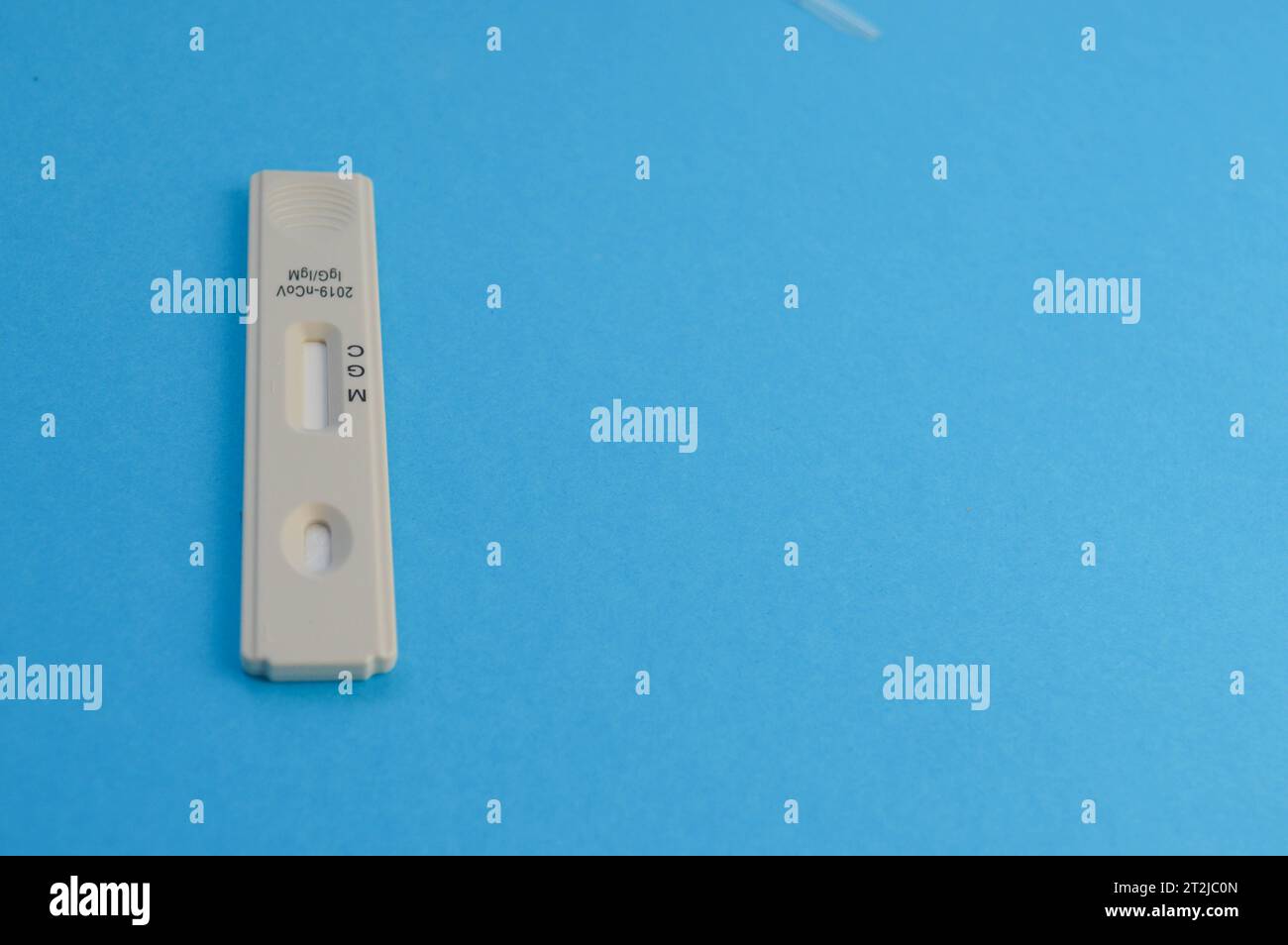 white test strip for the diagnosis of coronavirus infection. test on a ...
