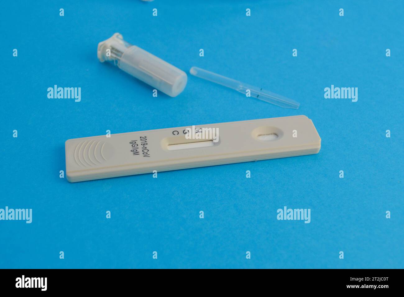white test strip for the diagnosis of coronavirus infection. test on a ...