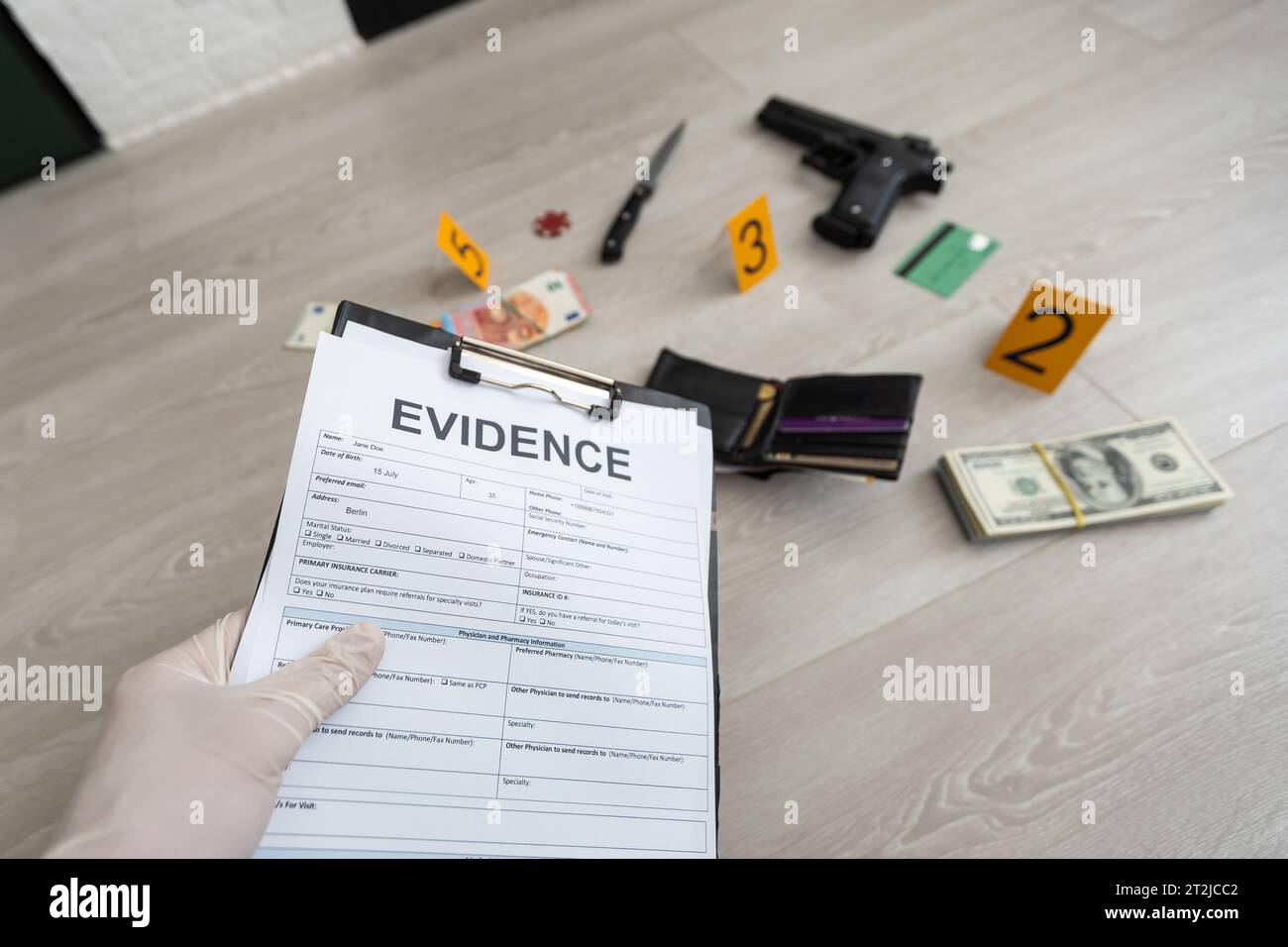 Closeup of 9 mm bullet case in evidence bag, fibres in glass tube ...