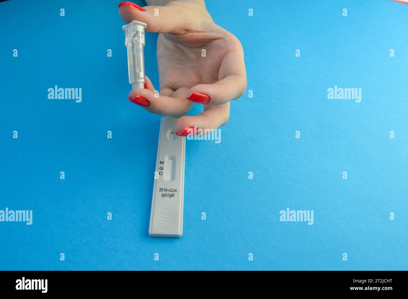 Doctor shows rapid laboratory COVID-19 test for detection of IgM and ...