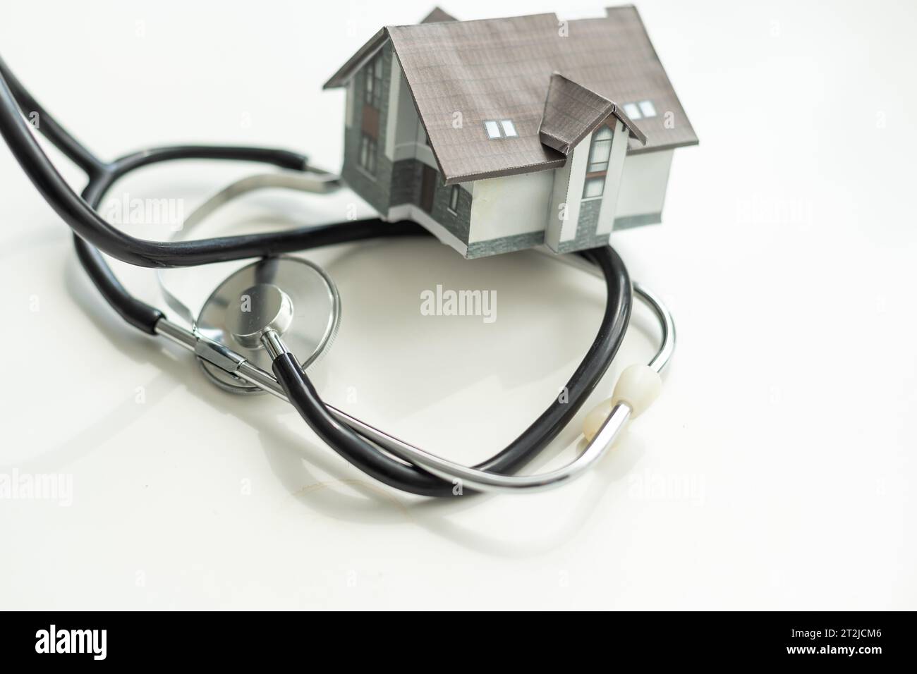 Miniature house and Medical stethoscope Stock Photo - Alamy