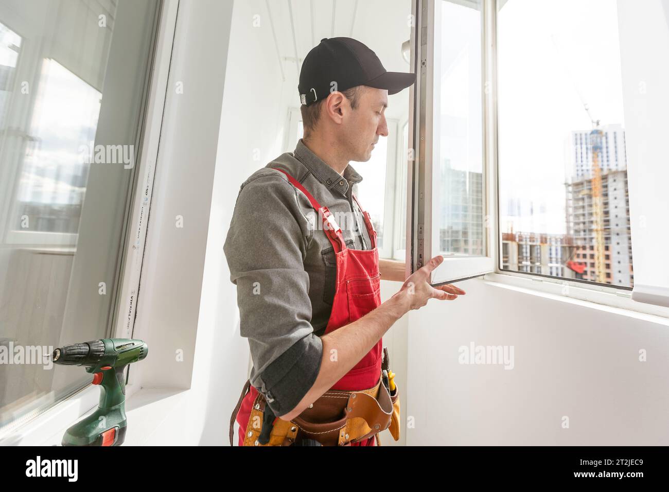 window installation wizard configures window closing Stock Photo - Alamy