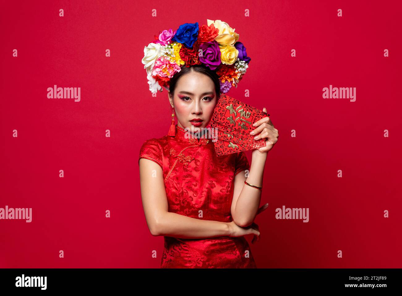 Gorgeous Asian woman in traditional oriental costume holding red ...