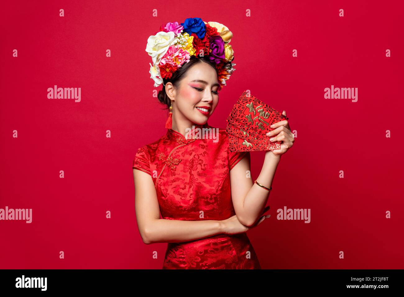 Beautiful Asian woman in traditional oriental costume holding red ...