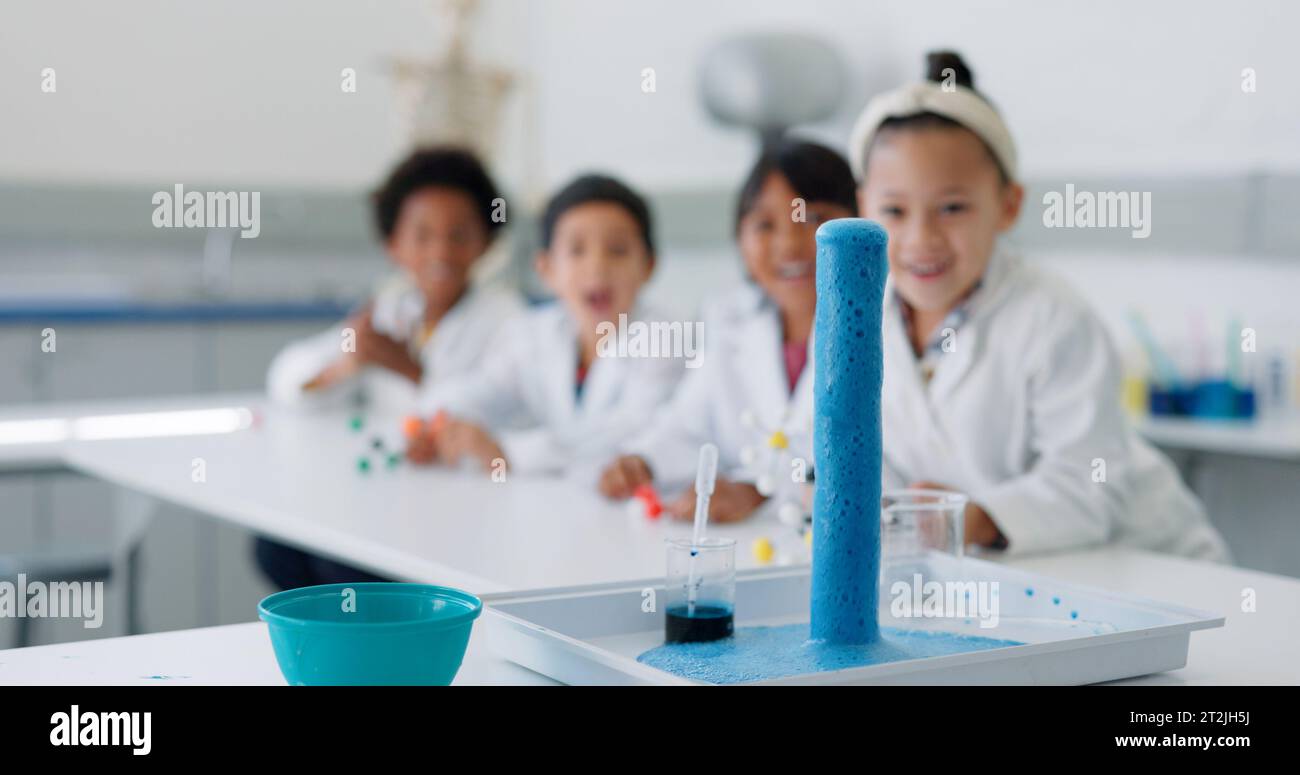 Science, experiment and chemical reaction with kids in a classroom at ...