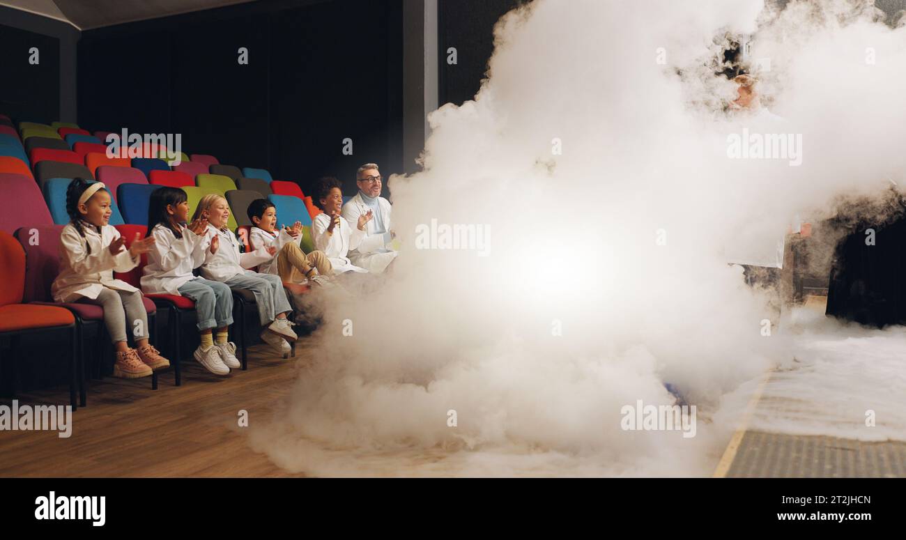 Chemistry, science education and smoke with students and classroom with ...