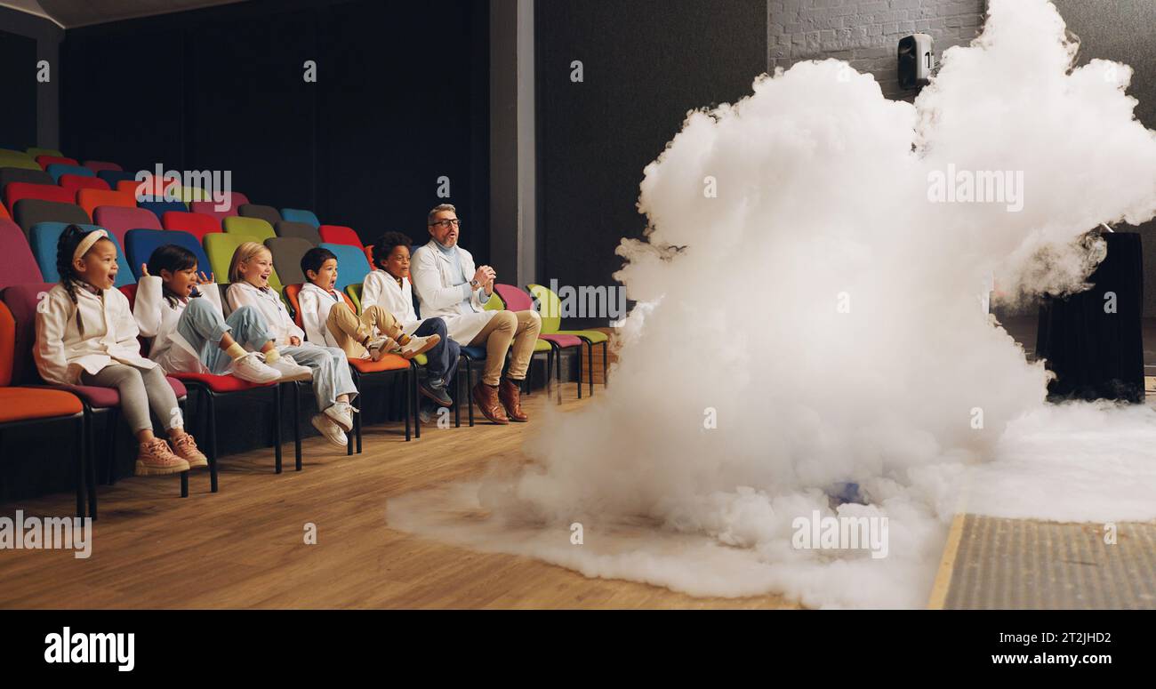 Chemistry, science and smoke with students and classroom with ...