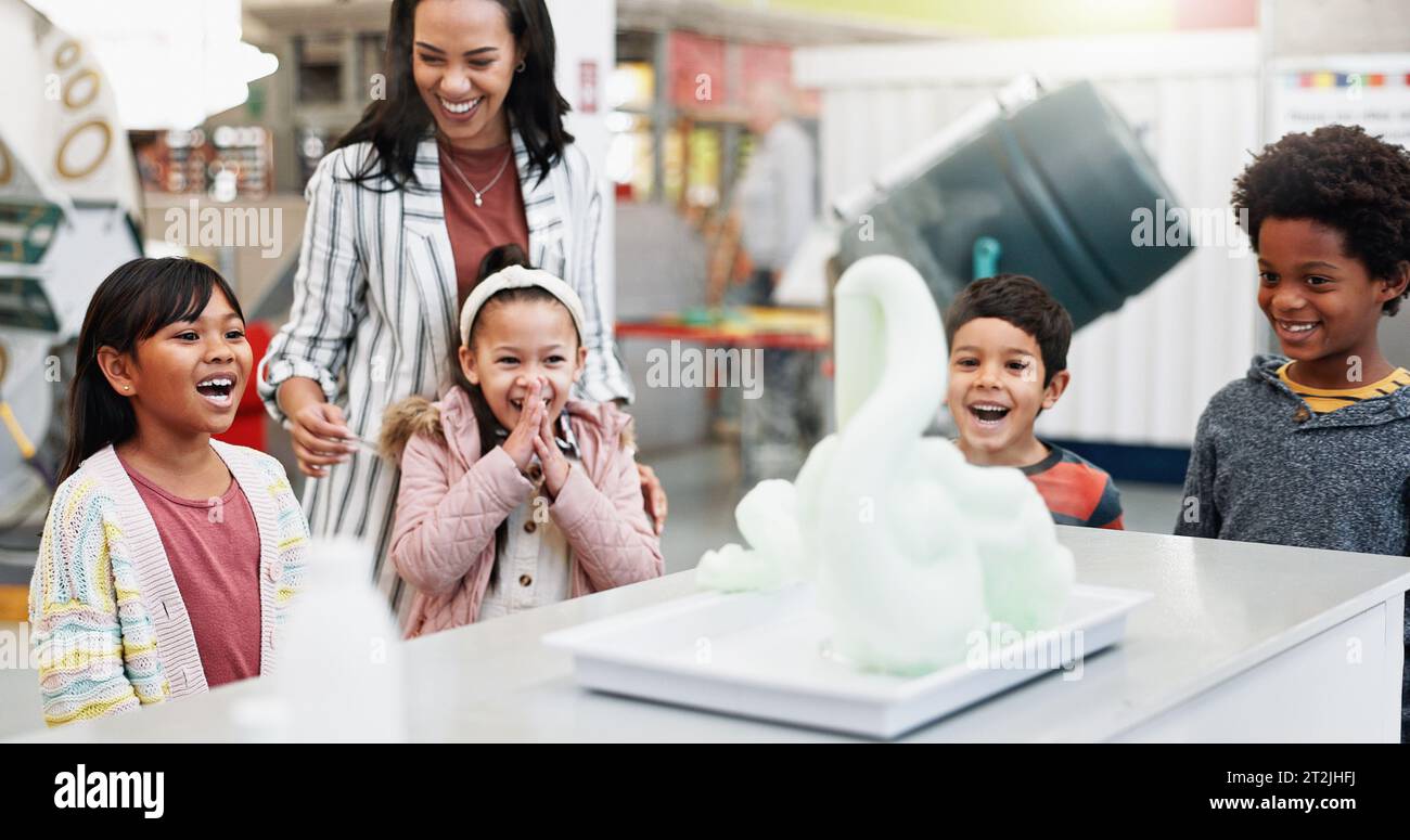 Experiment, teacher and students with science, excited and learning ...