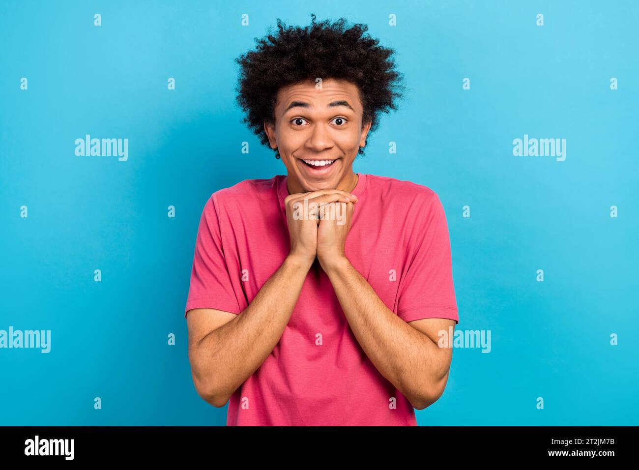 Photo of astonished overjoyed man with perming coiffure wear pink t ...
