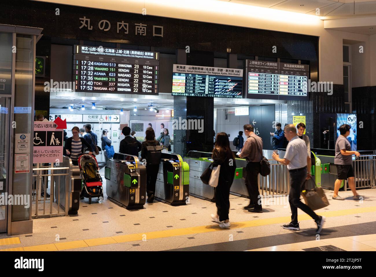 Tokyo, Japan. 17th Oct, 2023. Tokyoites and commuters alike pass ...