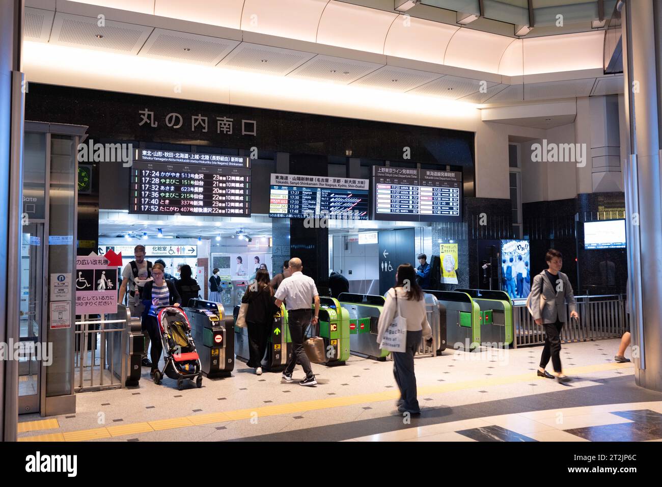 Tokyo, Japan. 17th Oct, 2023. Tokyoites and commuters alike pass ...