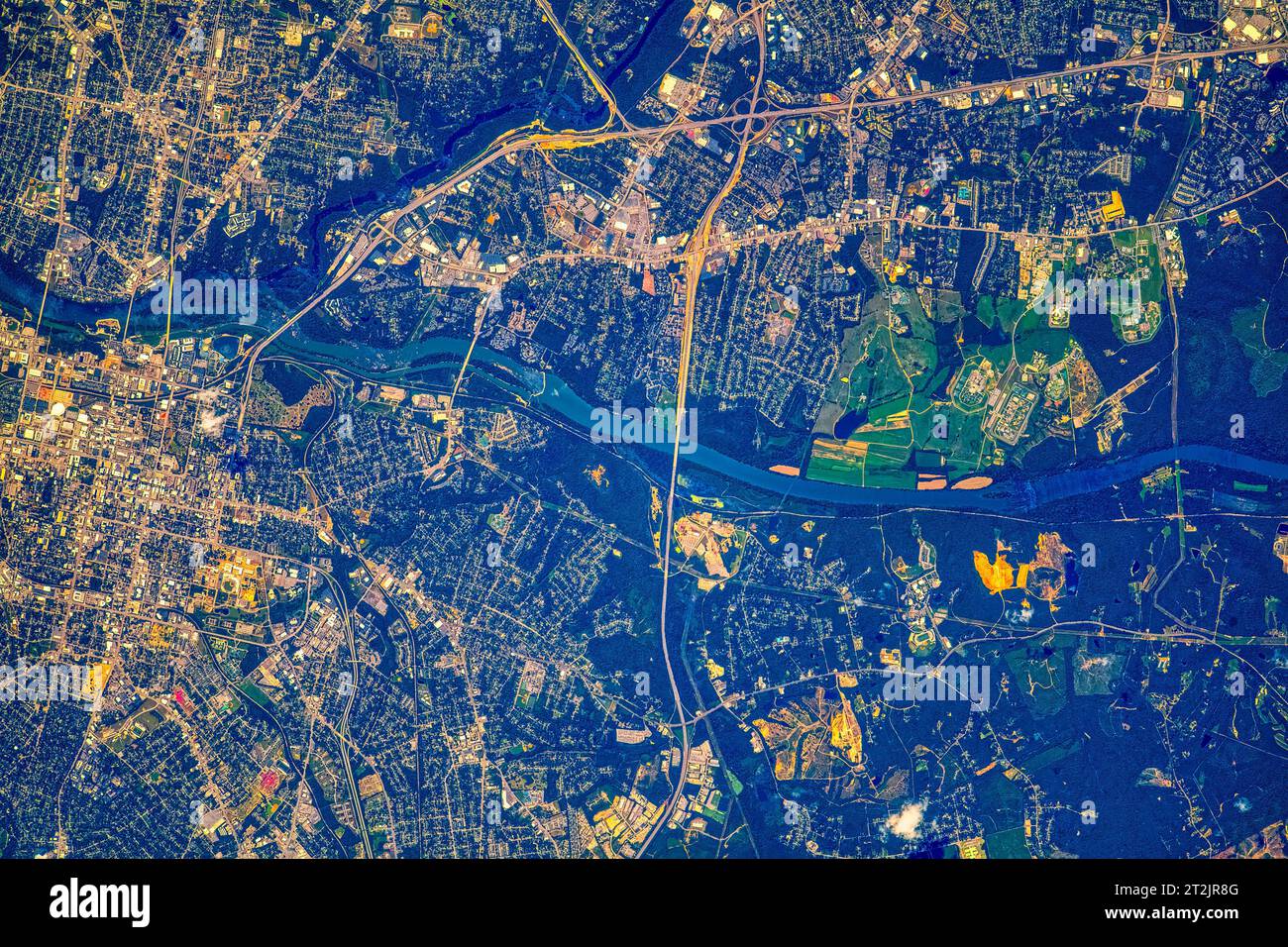 River and urban areas in Georgia, USA. Digital enhancement of an image ...