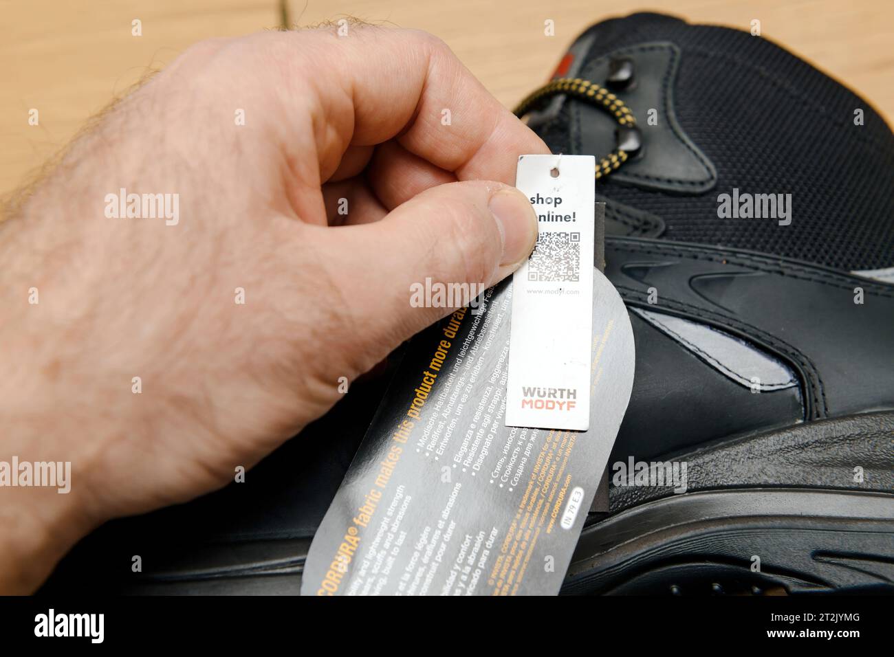 Hamburg, Germany - Feb 16, 2022: Examining the specifications label on ...