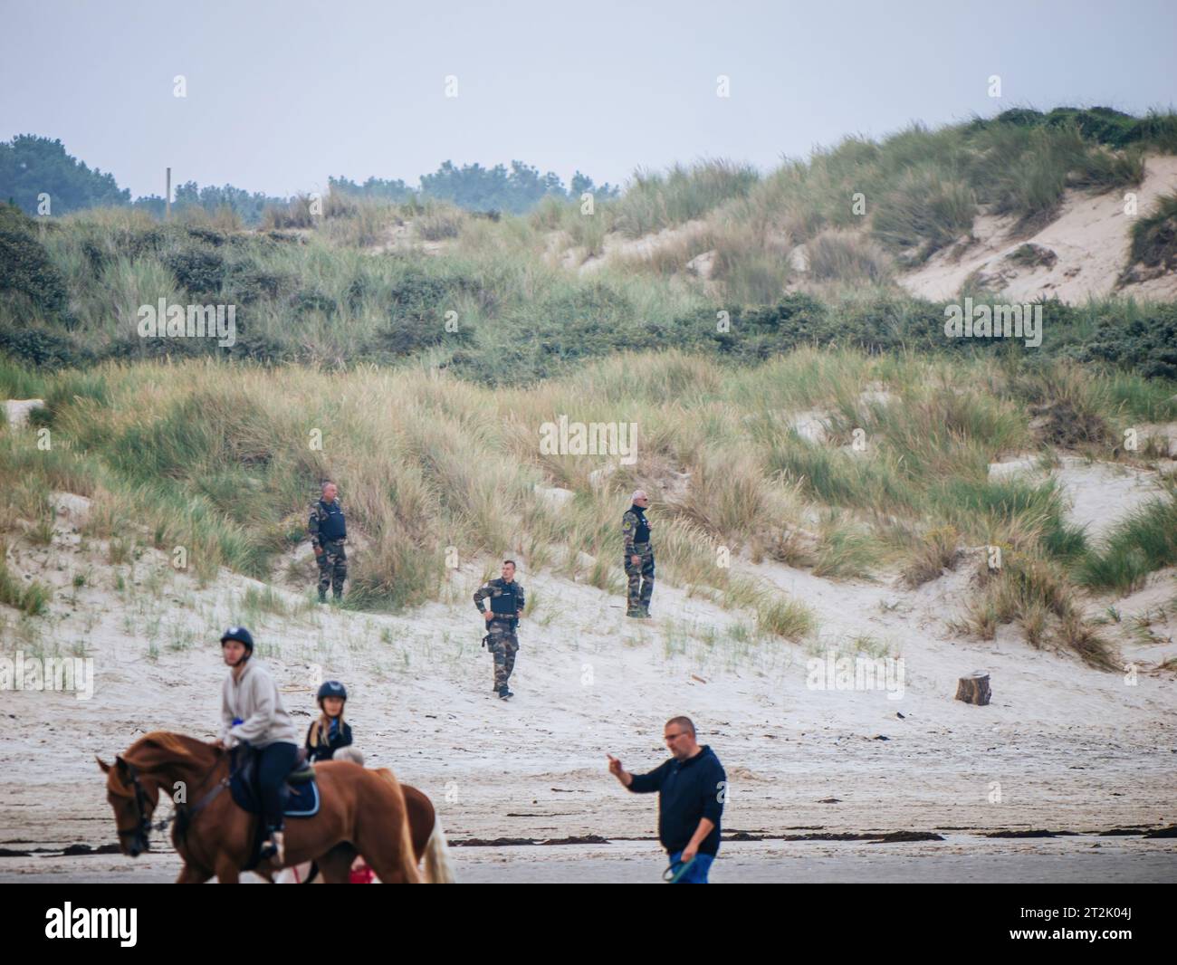Neufchatel-Hardelot, France - Aug 18, 2023: Beachgoers enjoy horseback ...