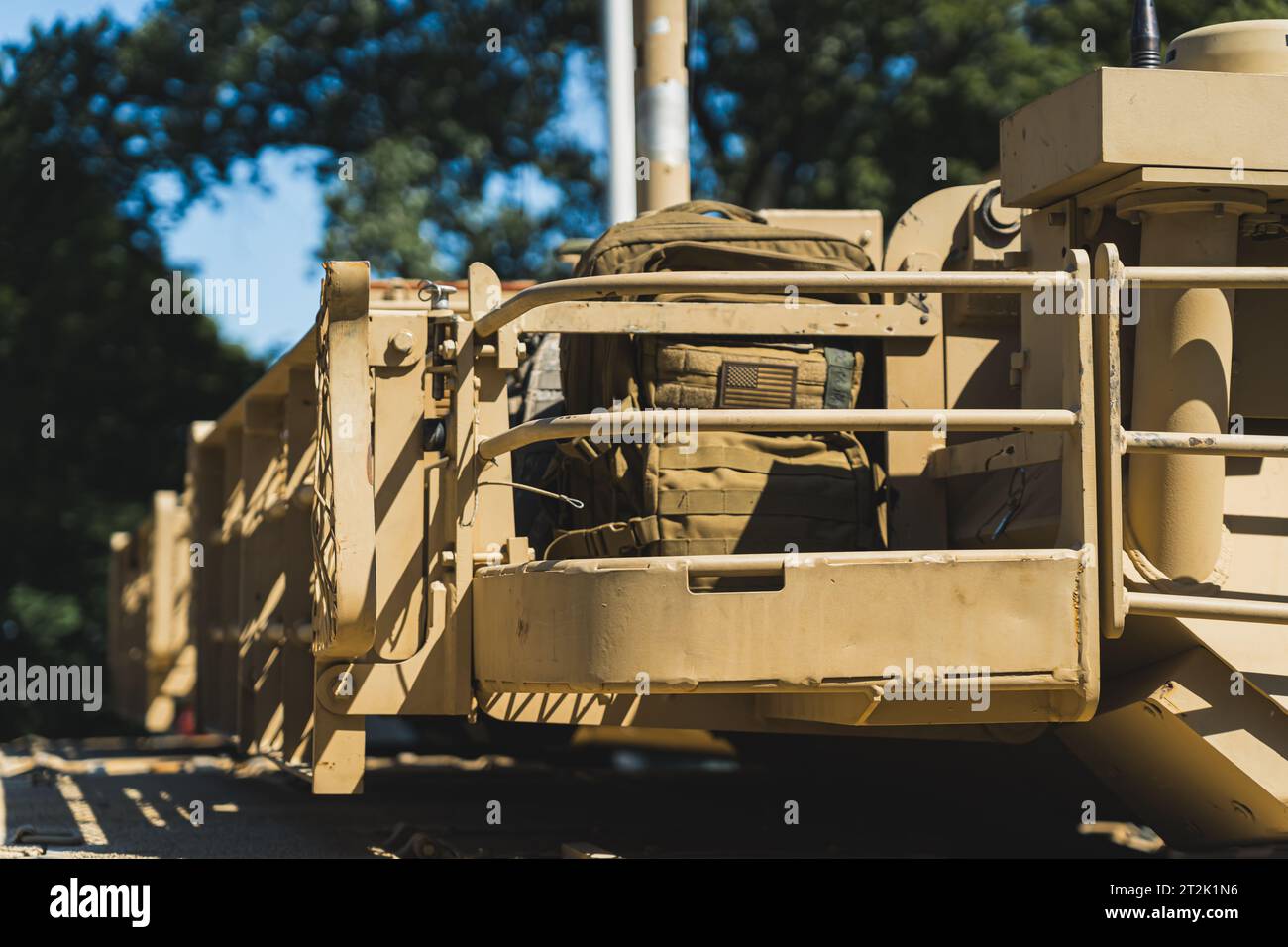 Military backpack with US flag placed on the M1 Abrams battle tank. No ...
