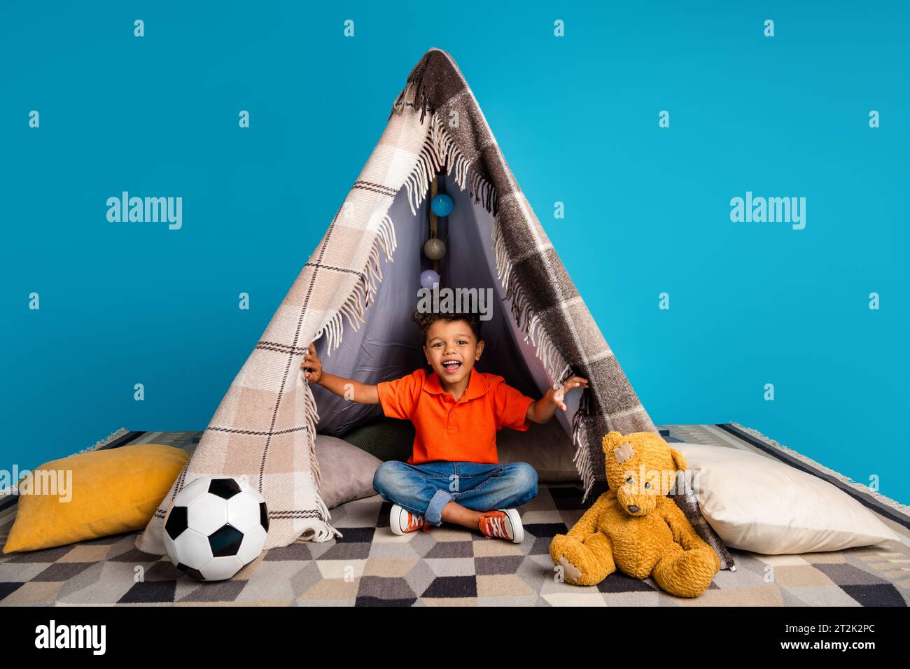 Photo of adorable boy having blanket house tent playing in nursery room ...
