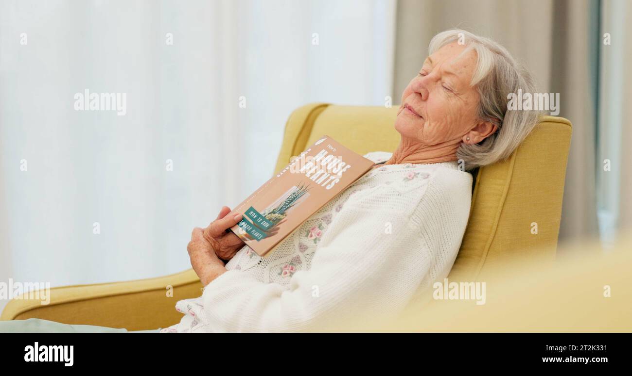 Relax, book and senior woman sleeping in the living room of her modern ...