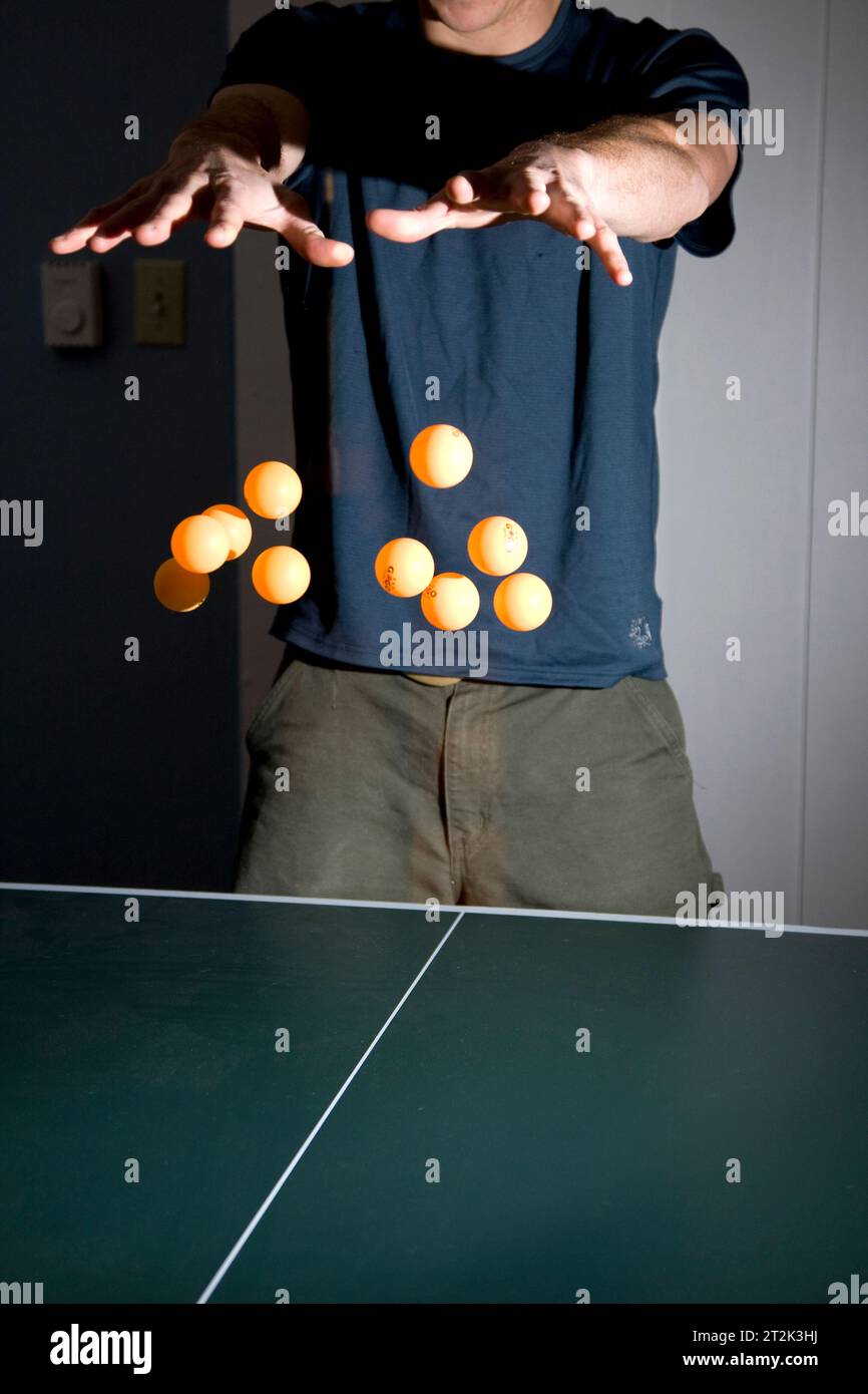 A man pretends to show that he is capable of levitating 10 Ping-Pong ...