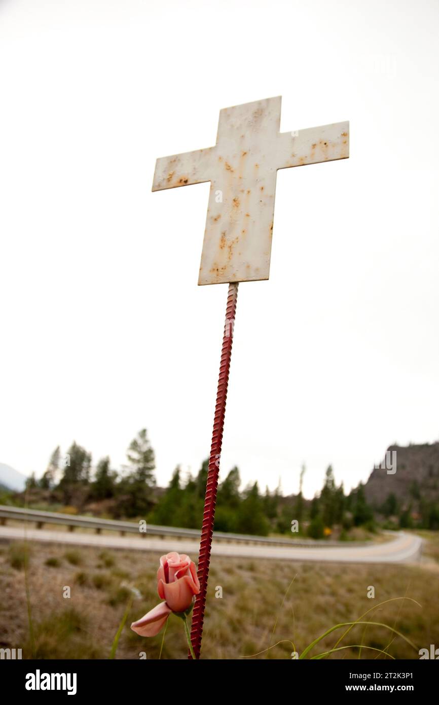 A white cross signifying a death along a dangerous highway Stock Photo ...